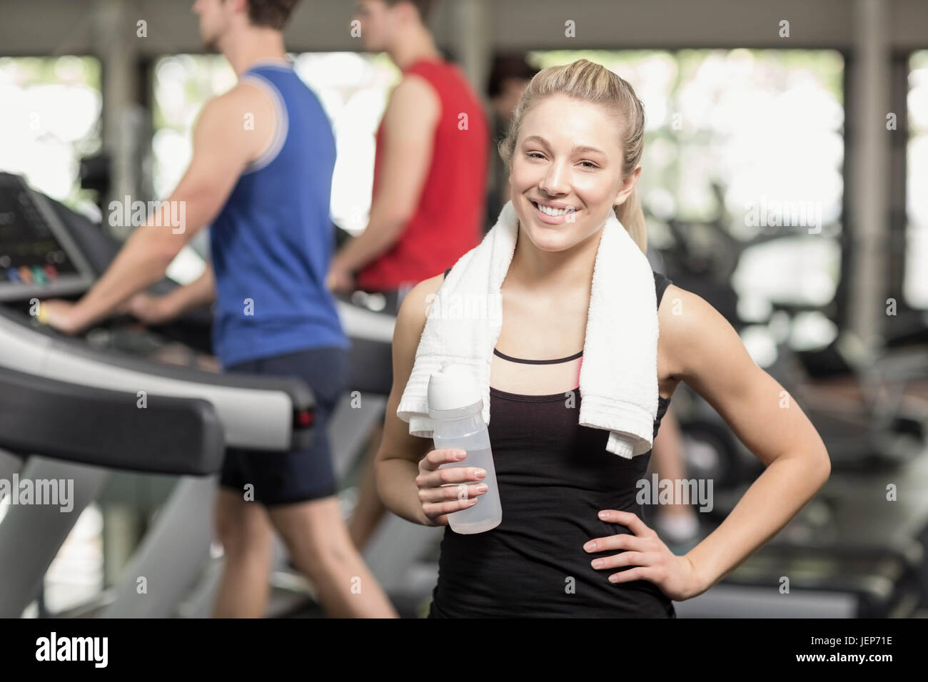 Fit woman posing with hands on hips Stock Photo - Alamy