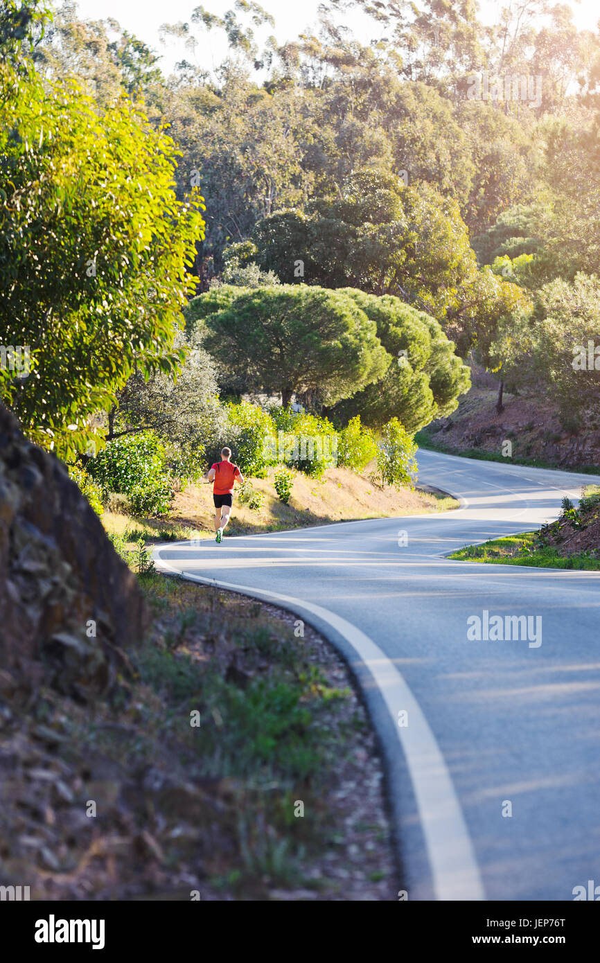 Man running on rural road rear view hi-res stock photography and images ...