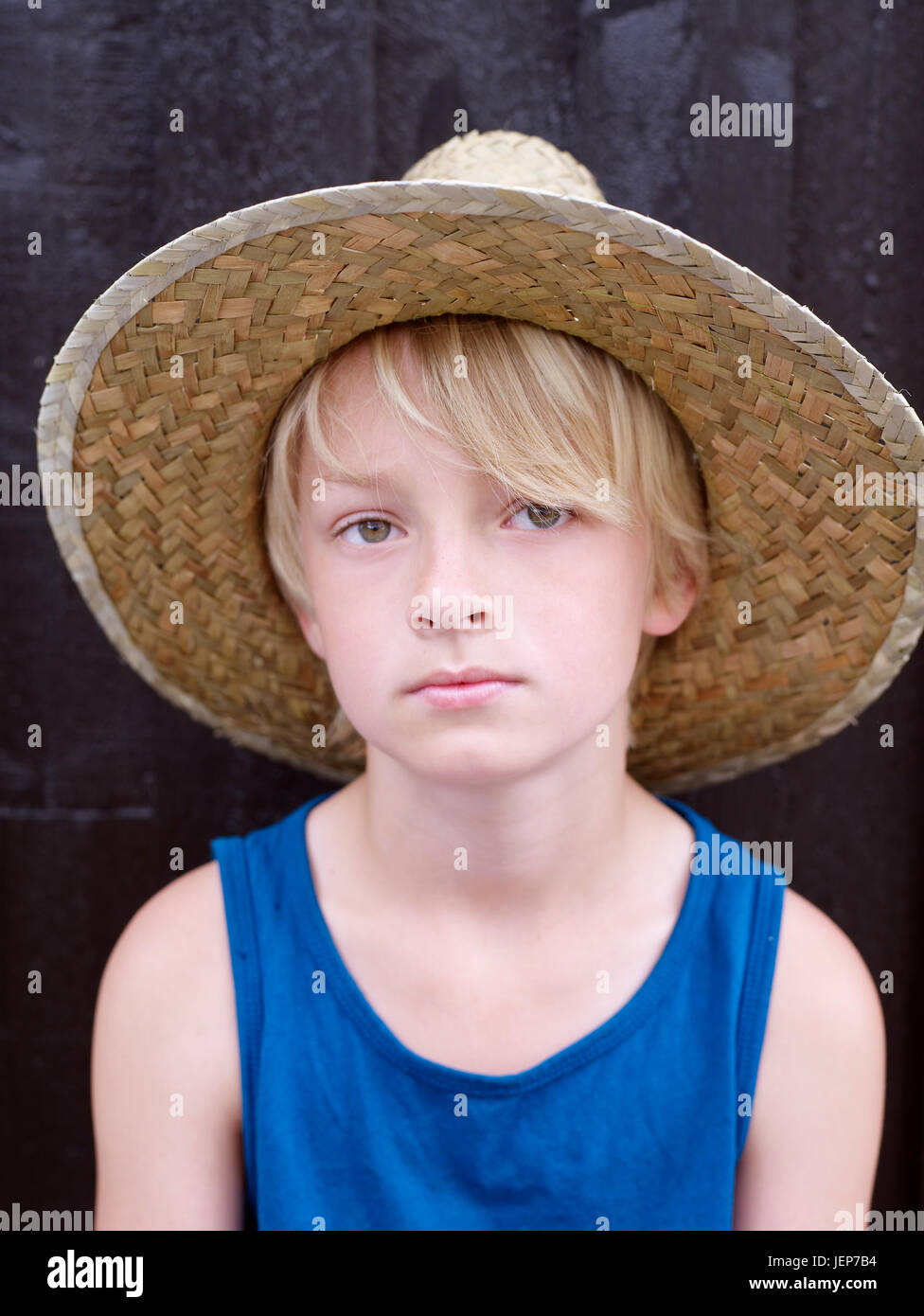 Boy wearing straw hat Stock Photo - Alamy