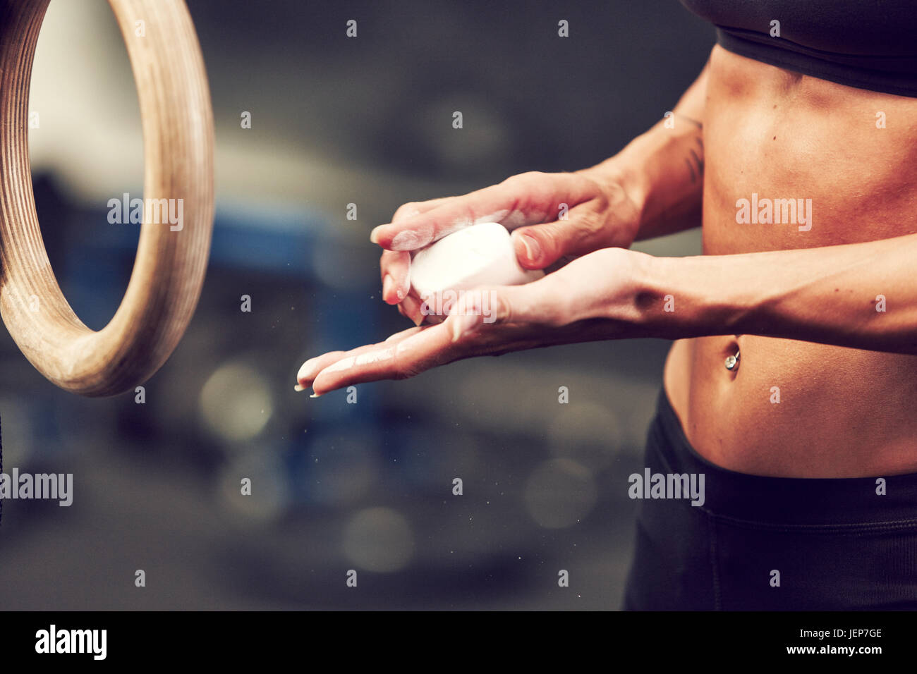 Woman chalking hands Stock Photo - Alamy
