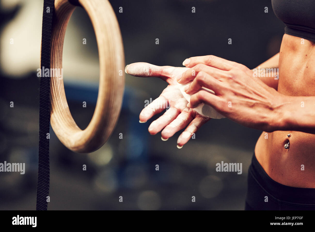 Woman chalking hands Stock Photo - Alamy