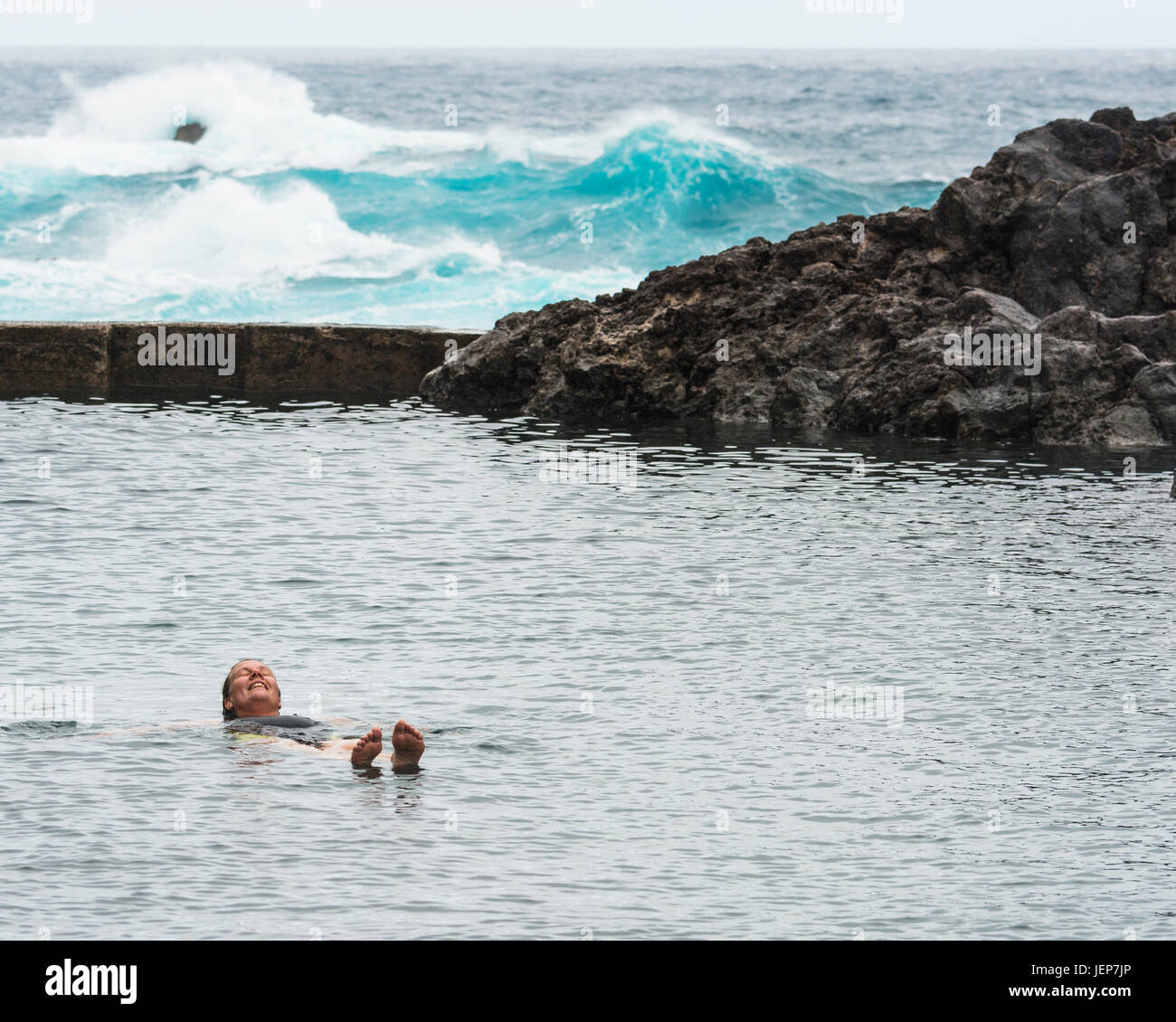 Woman swimming in sea Stock Photo - Alamy