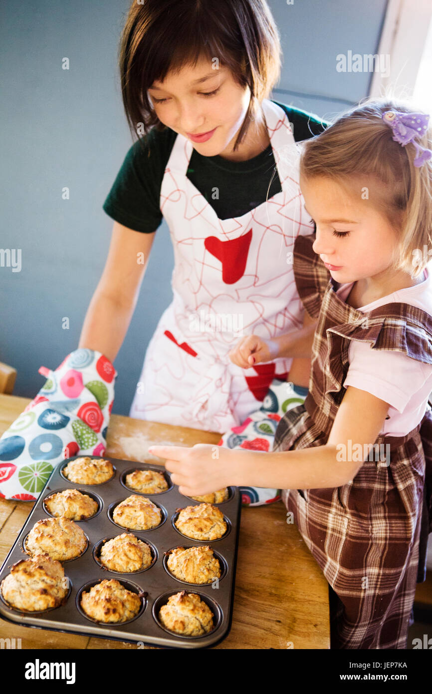 Two sisters cooking together hi-res stock photography and images - Alamy