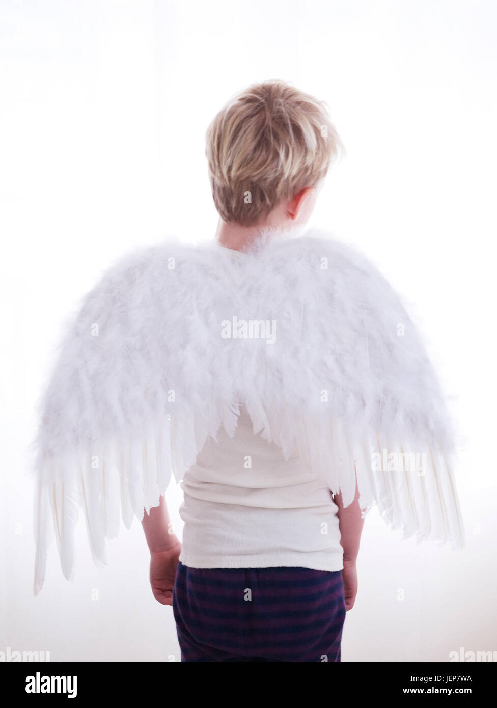 Boy wearing wings Stock Photo - Alamy