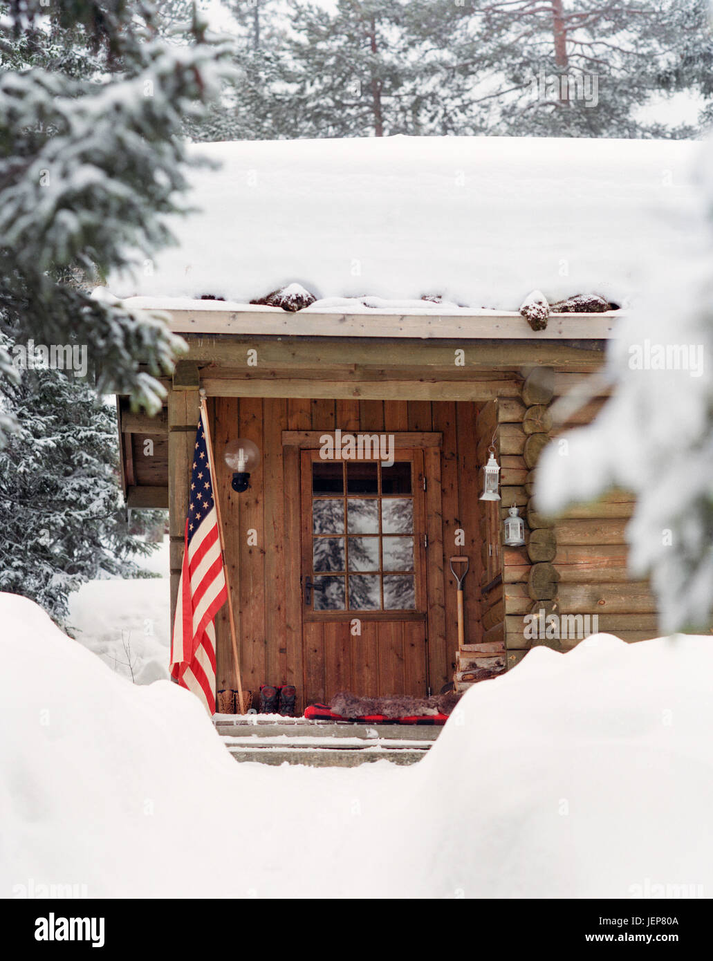 Wooden house with American flag Stock Photo - Alamy