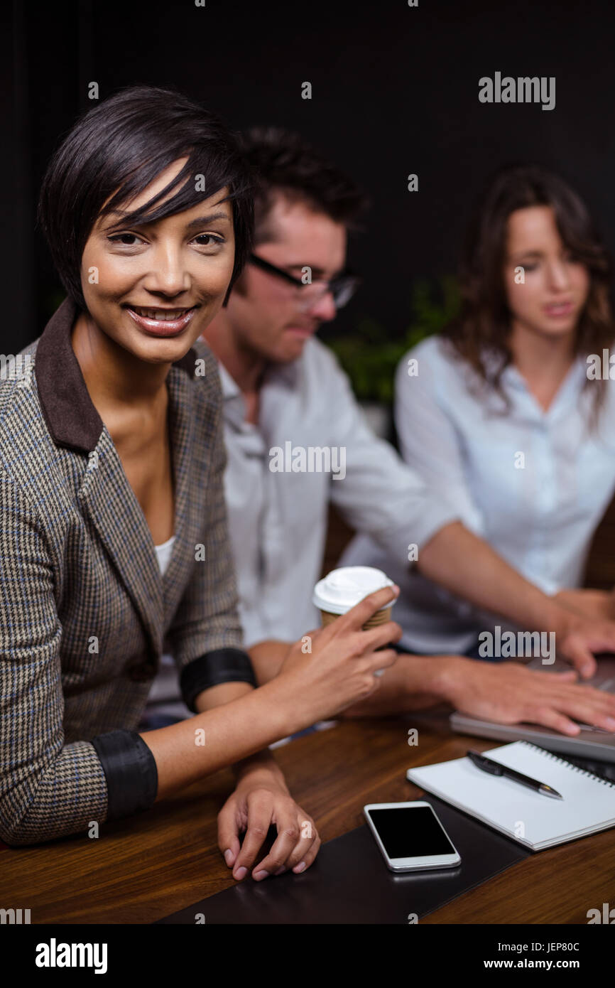 Friends using laptop together Stock Photo - Alamy