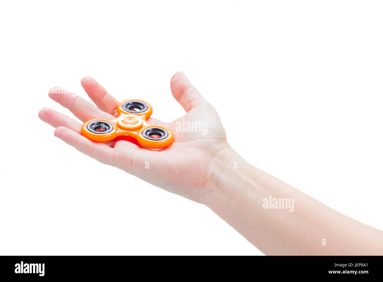 Hand holding spinning fidget spinner, popular relaxing toy, generic ...
