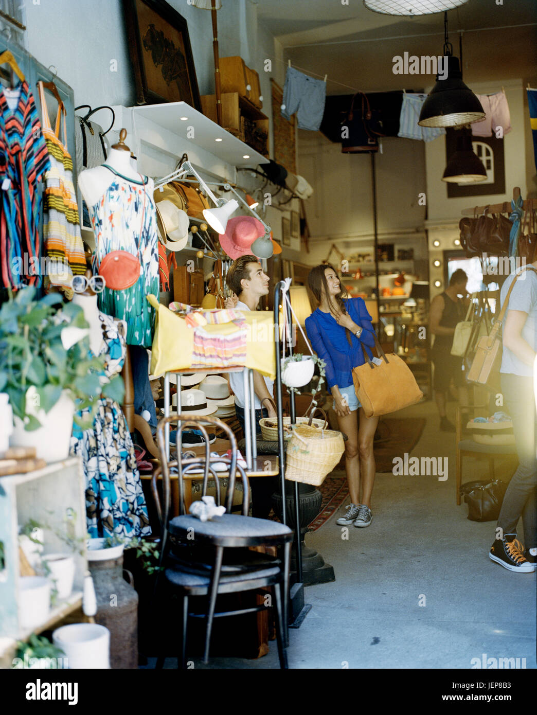 Woman in second hand store hi-res stock photography and images - Alamy
