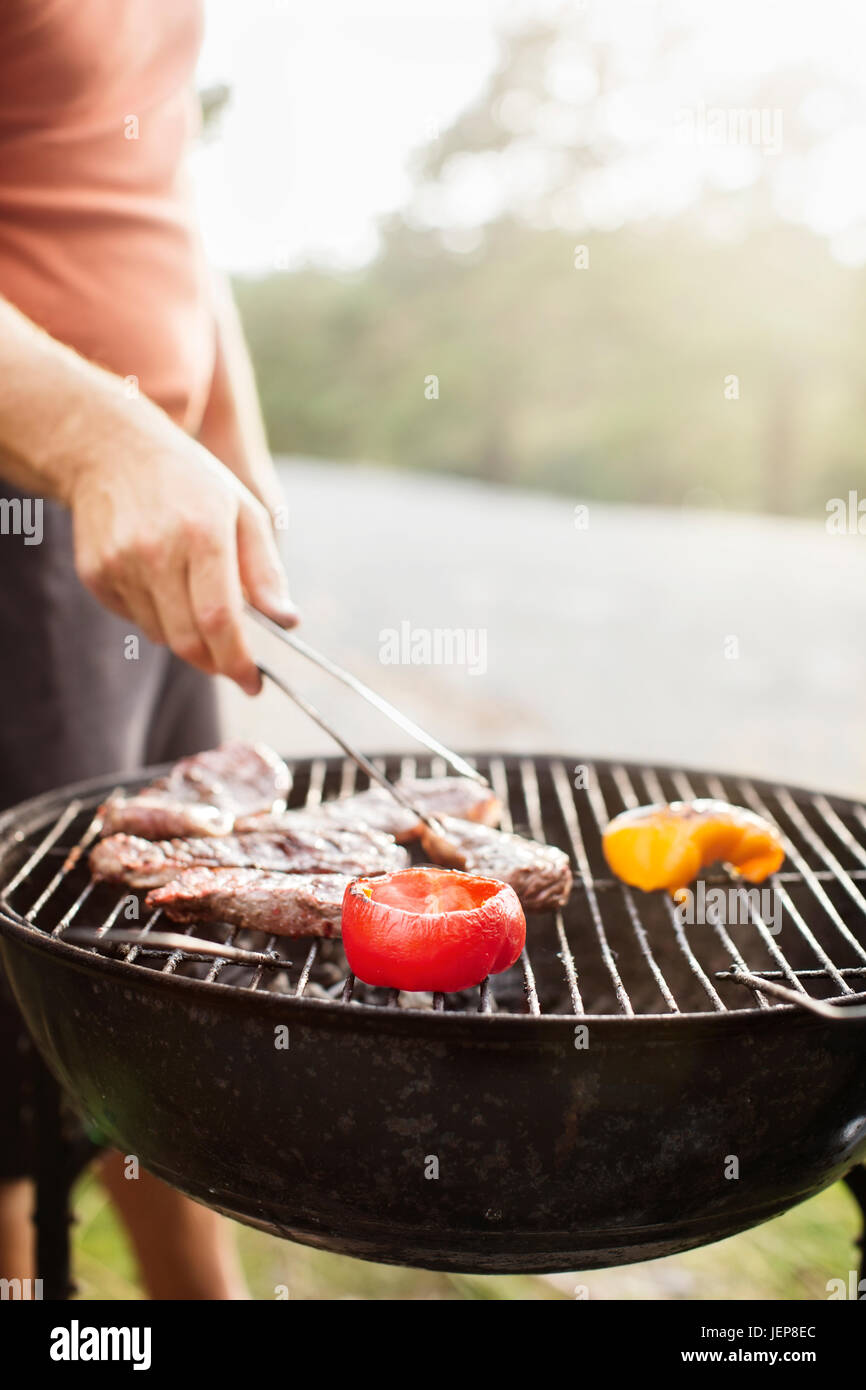 Man having barbecue Stock Photo - Alamy