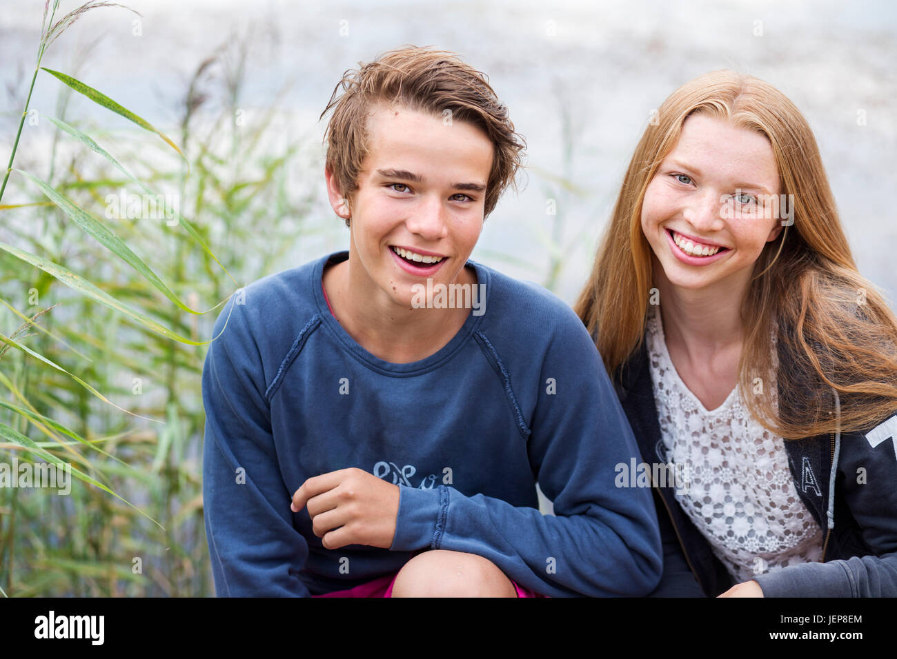 Portrait of smiling teenagers Stock Photo - Alamy