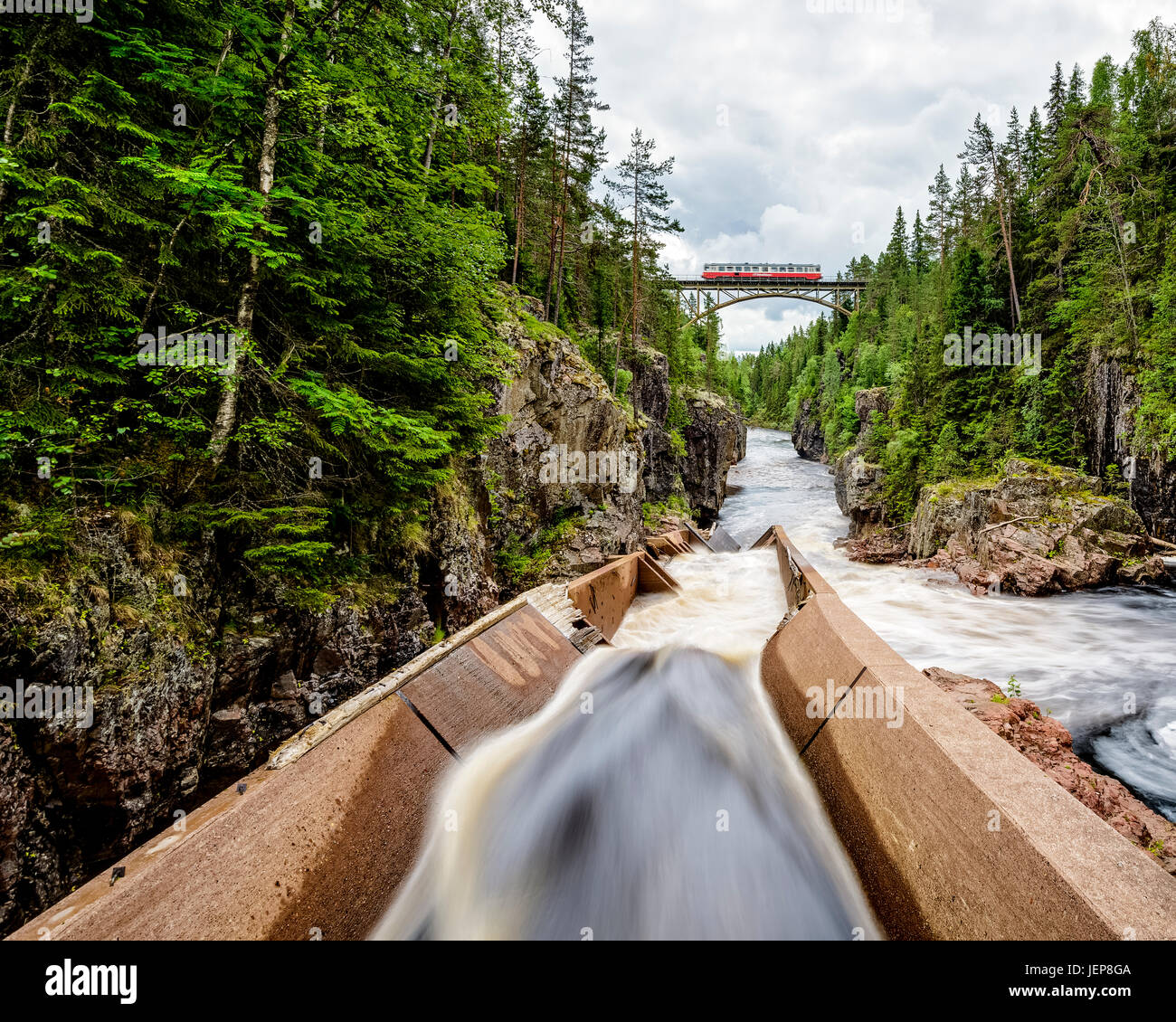 Train bridge over stream Stock Photo - Alamy
