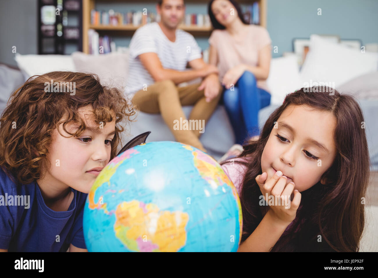 Children looking at map hi-res stock photography and images - Alamy