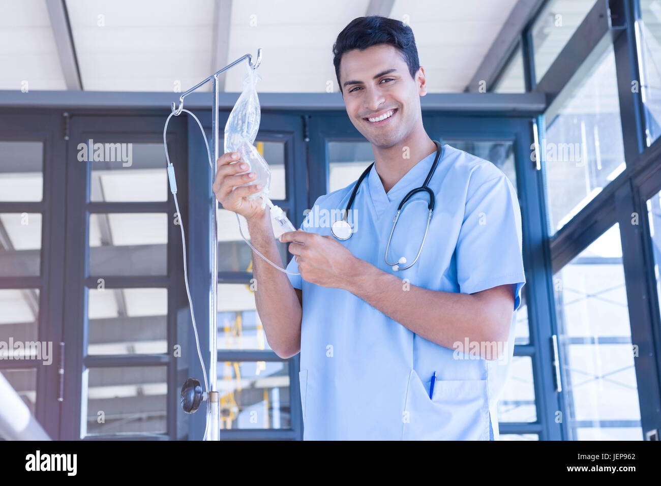 Doctor holding intravenous drip Stock Photo - Alamy