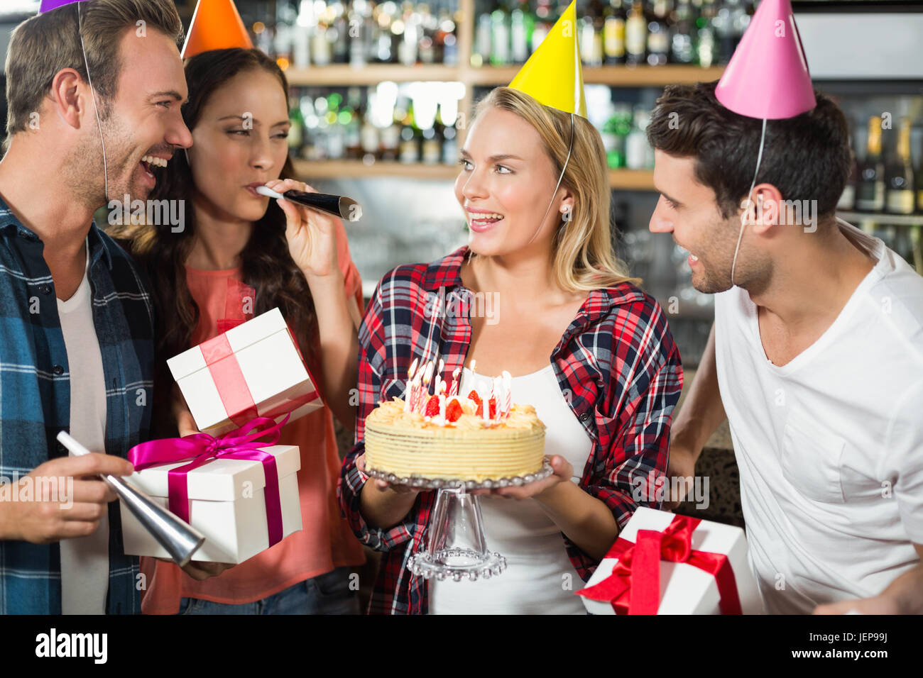 Woman smiling with cake in hands Stock Photo - Alamy