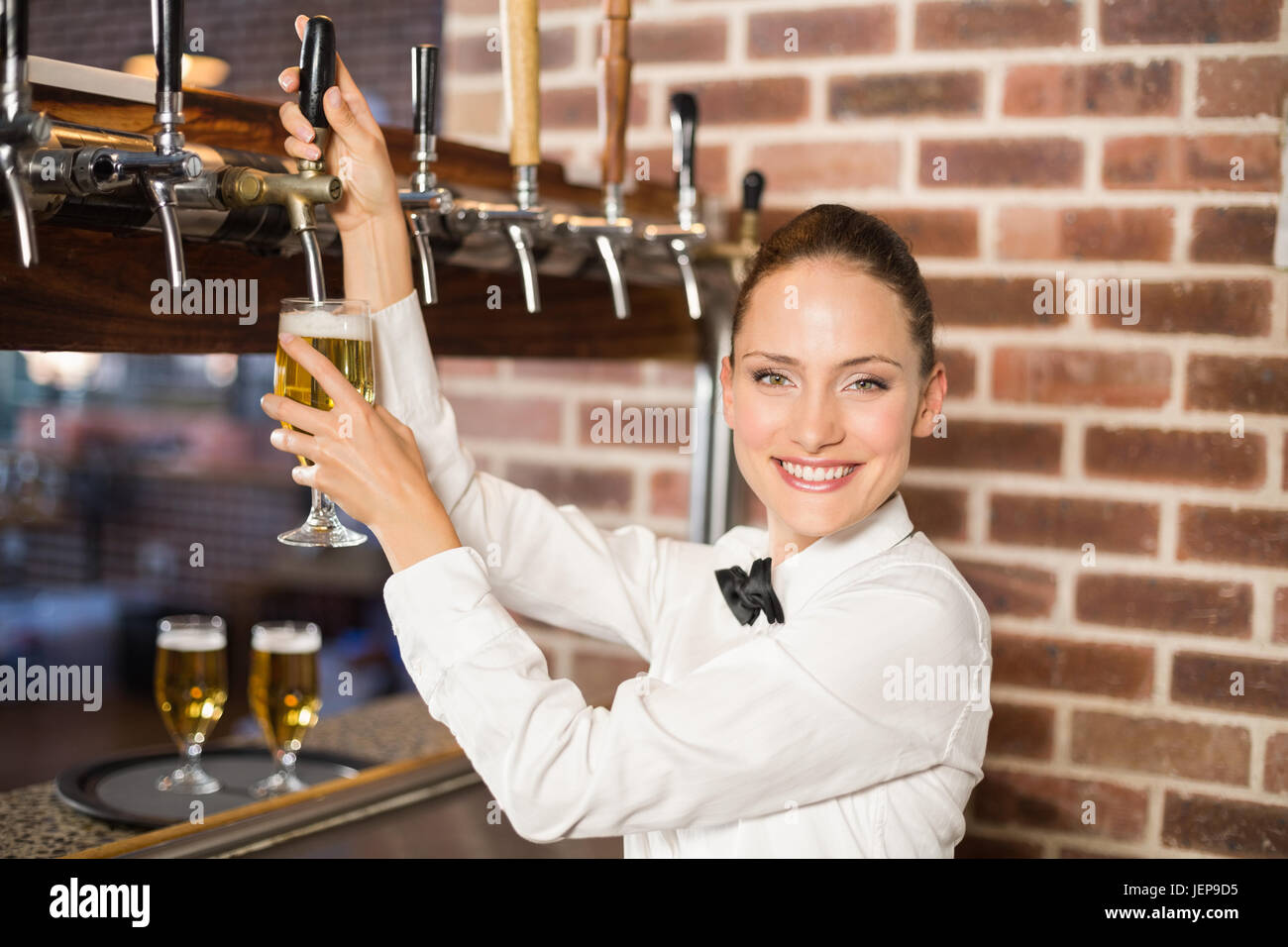 Barmaid pouring beer hi-res stock photography and images - Alamy