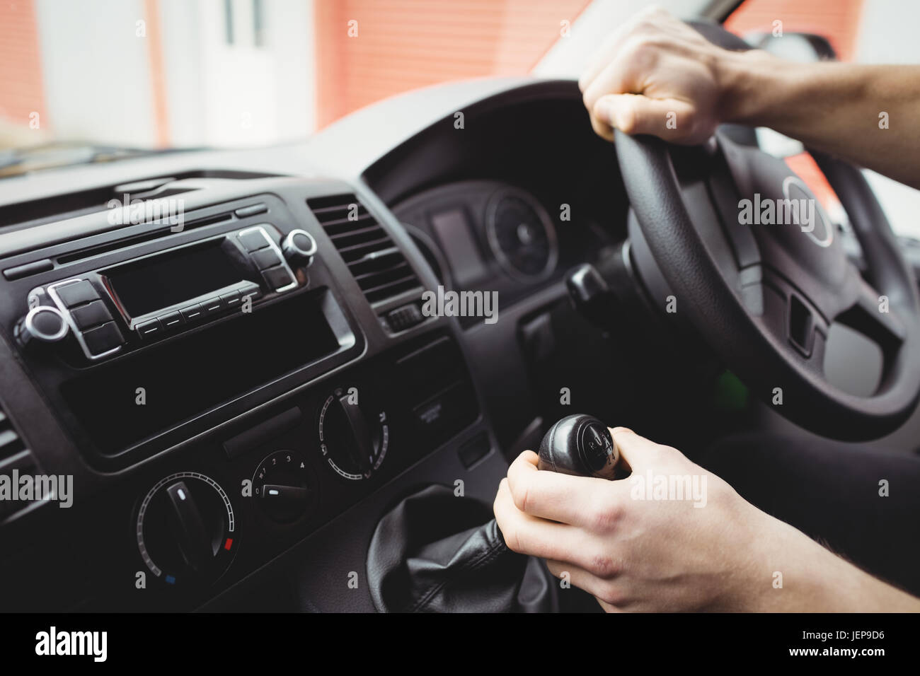 Man using gear change Stock Photo - Alamy