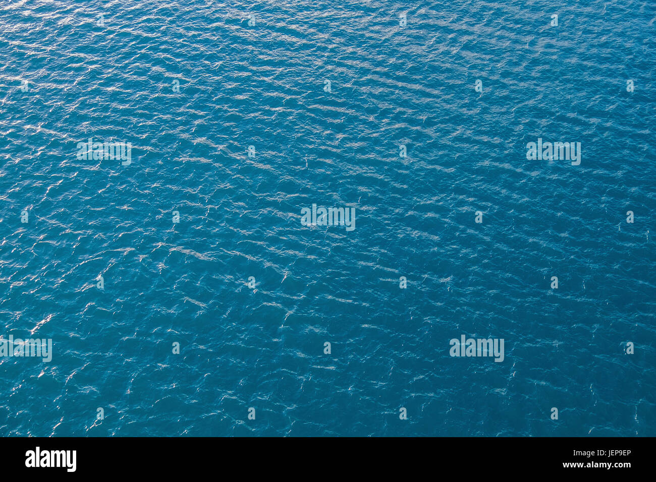 Vast blue ocean background with moderate waves Stock Photo - Alamy