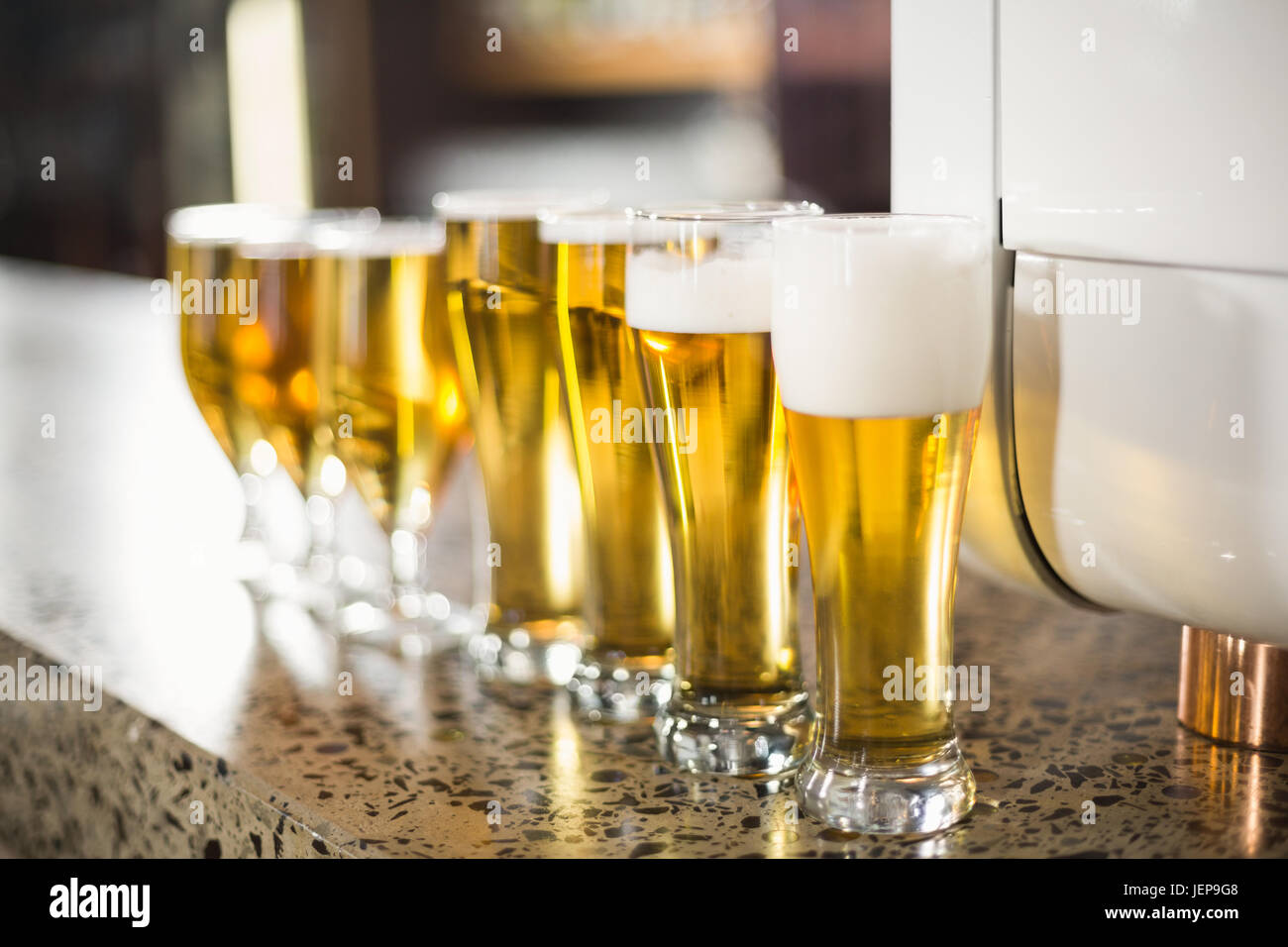 Lined up beers on table Stock Photo - Alamy