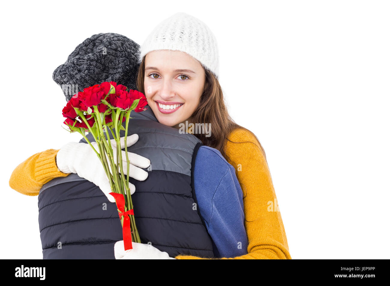 Happy couple hugging each other with flowers Stock Photo - Alamy