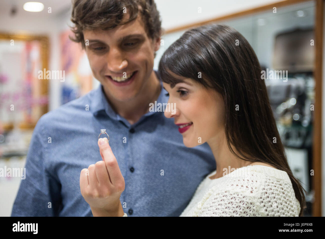 Jeweler looking at ring hi-res stock photography and images - Alamy