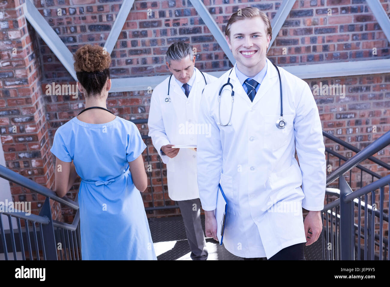 Doctors walking together hi-res stock photography and images - Alamy