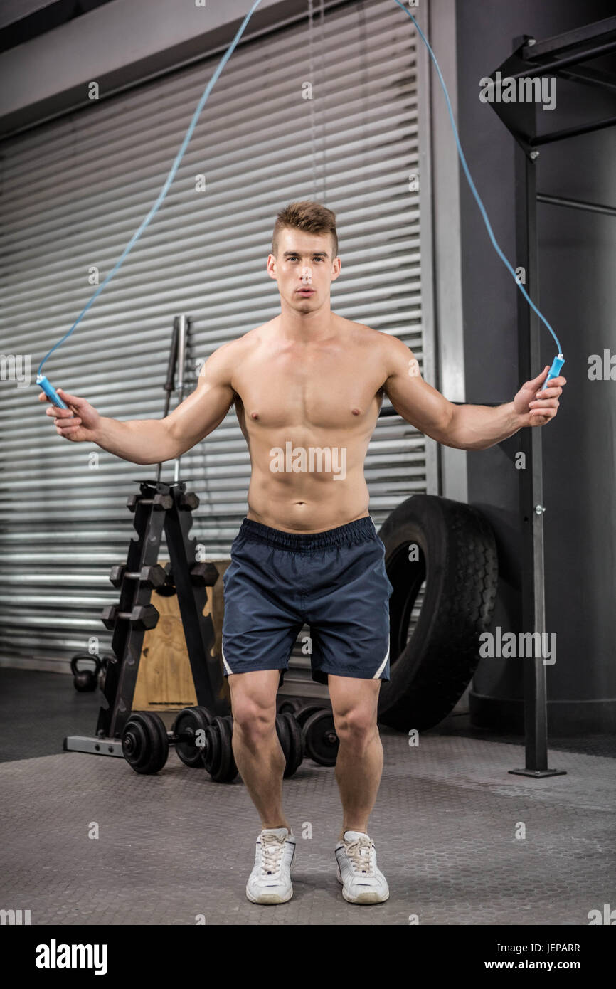 Shirtless man jumping the rope Stock Photo - Alamy