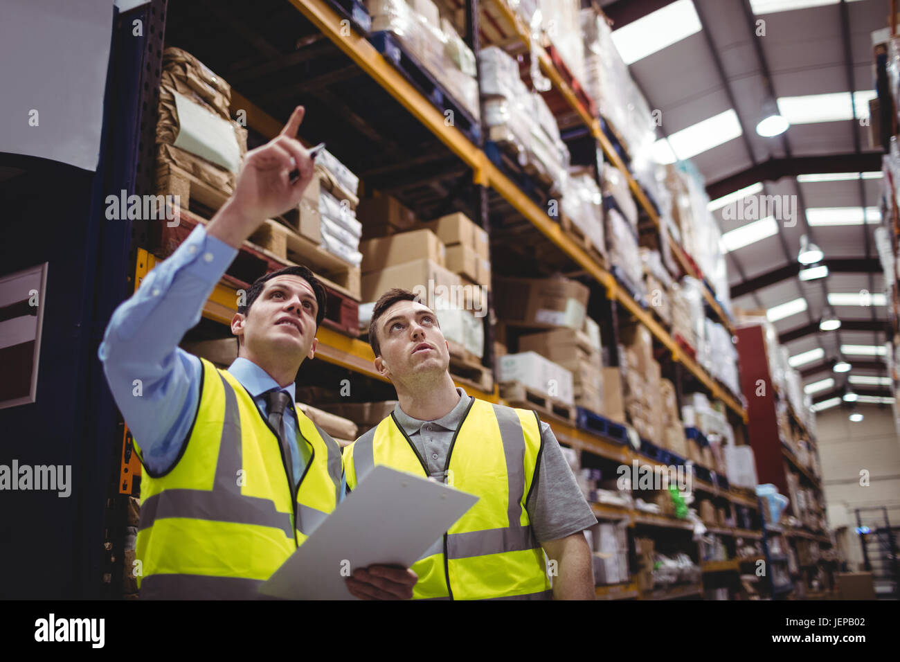 Manager and worker talking Stock Photo - Alamy