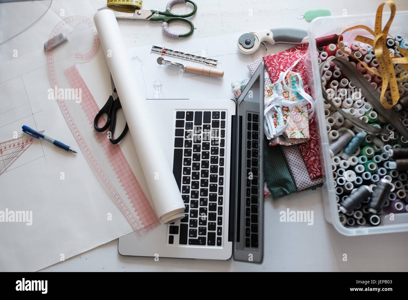 Working place of tailor with sewing tools Stock Photo - Alamy