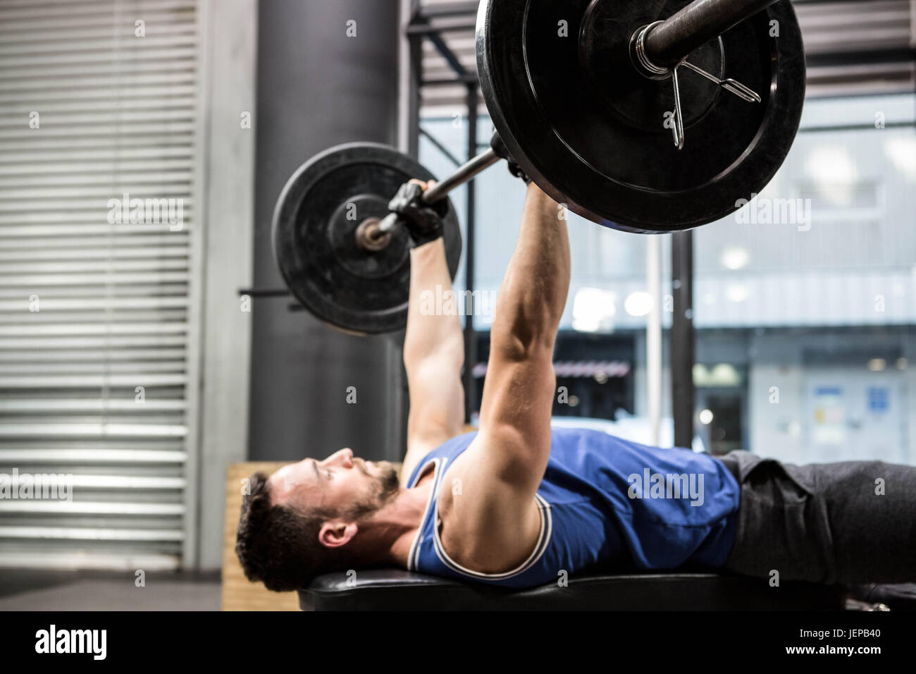 Athlete lifting barbell on bench hi-res stock photography and images ...