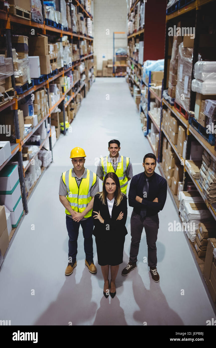 Portrait warehouse team standing arms hi-res stock photography and ...
