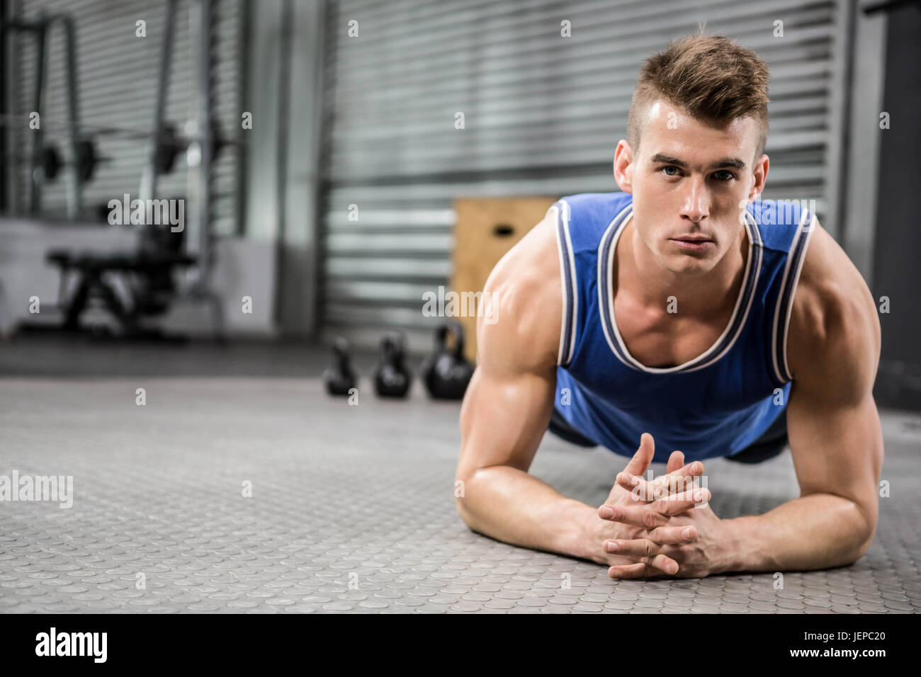 Muscular man planking Stock Photo - Alamy