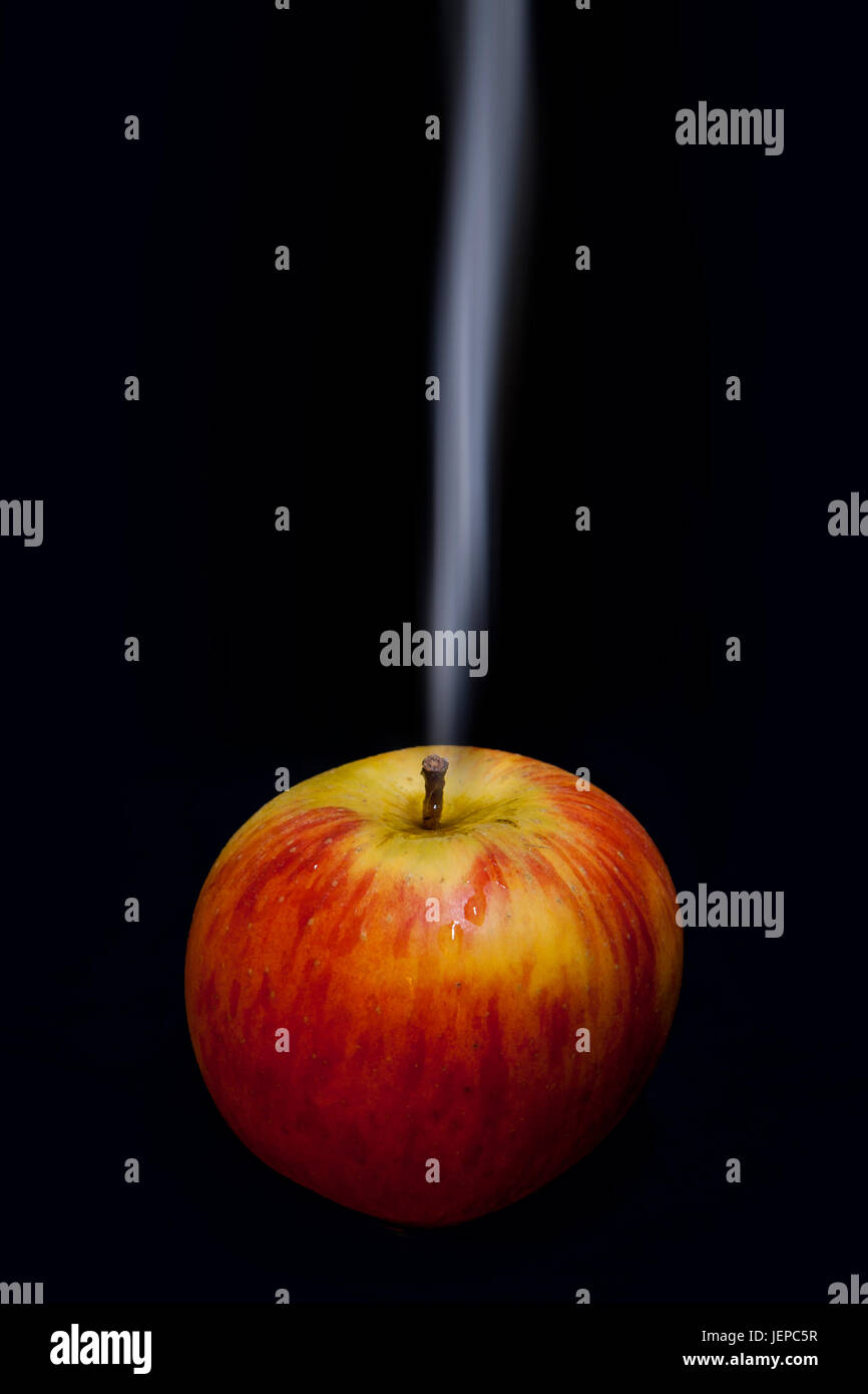 An apple with smoke coming off it Stock Photo - Alamy