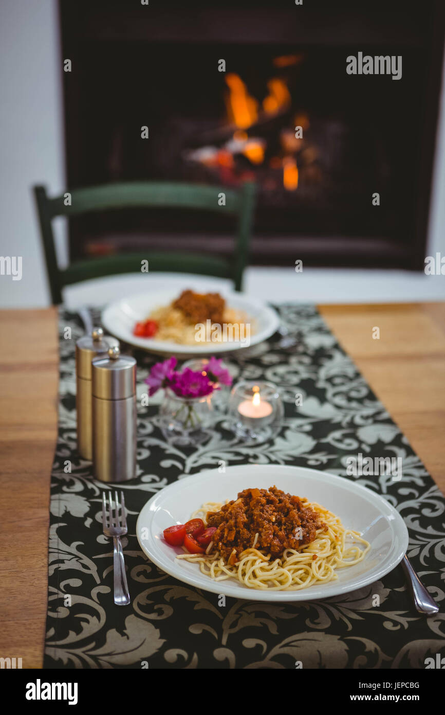 Plates of spaghetti on table Stock Photo - Alamy