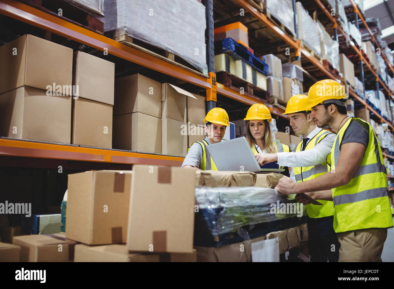 Portrait of smiling warehouse managers Stock Photo - Alamy