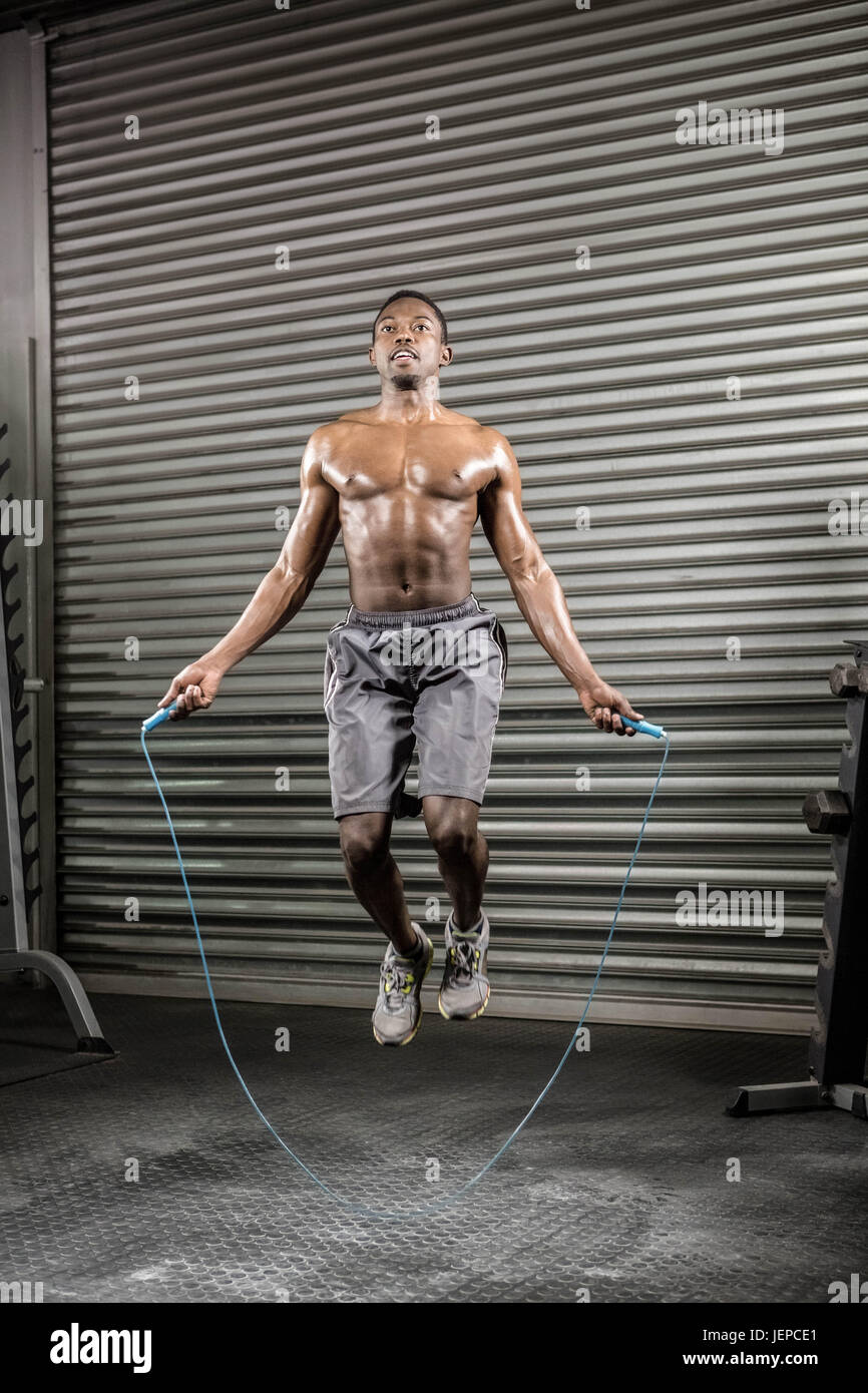 Shirtless man jumping the rope Stock Photo - Alamy