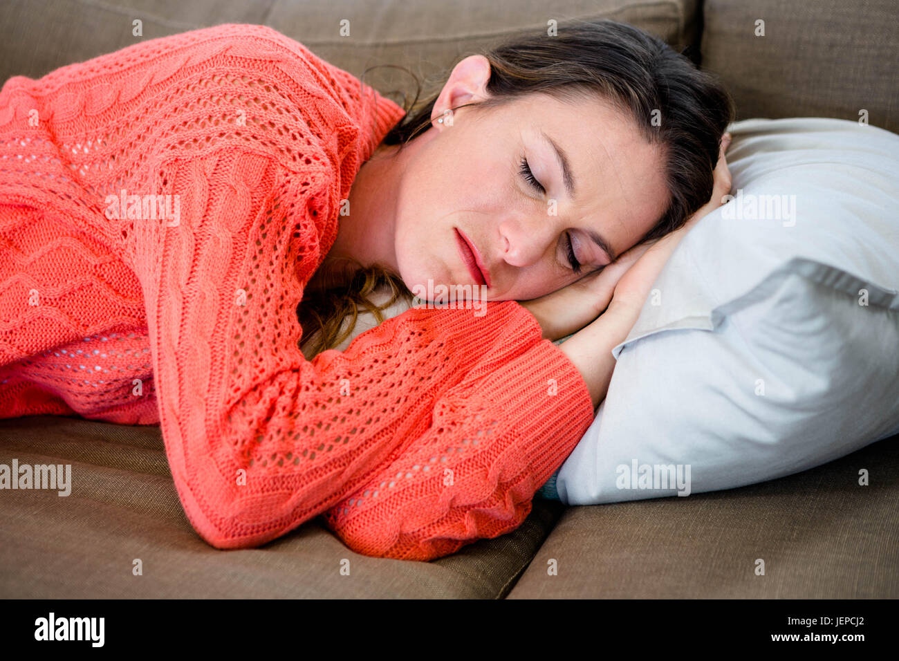 Woman taking a nap sofa hi-res stock photography and images - Alamy