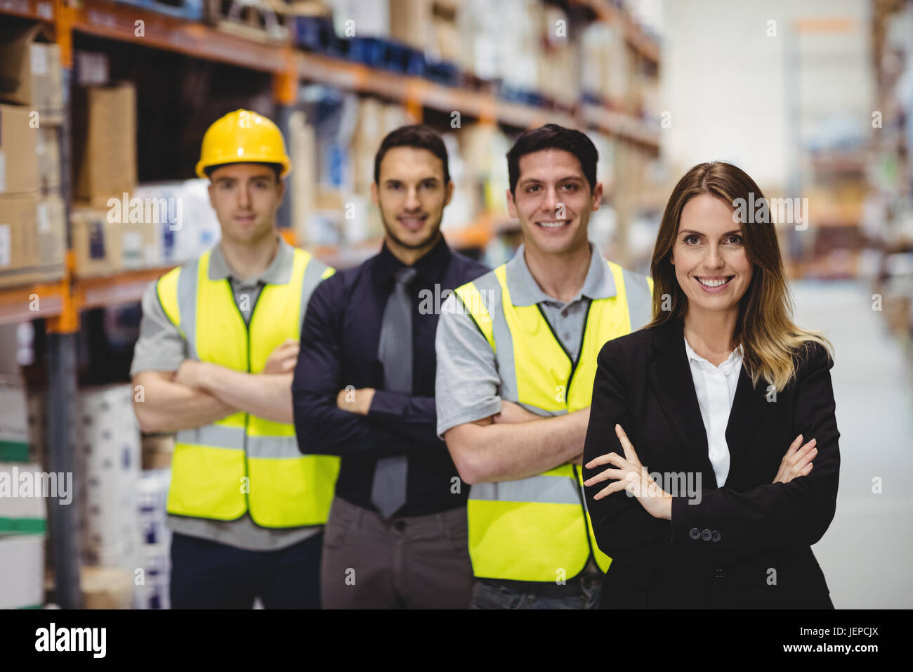 Portrait warehouse team standing arms hi-res stock photography and ...