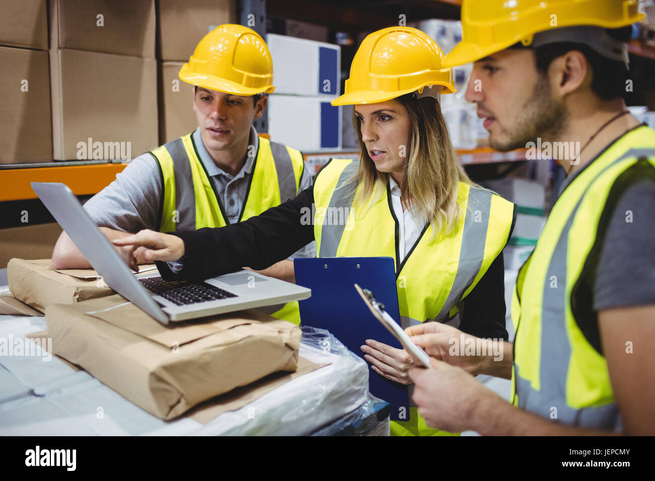 Portrait of smiling warehouse managers Stock Photo - Alamy