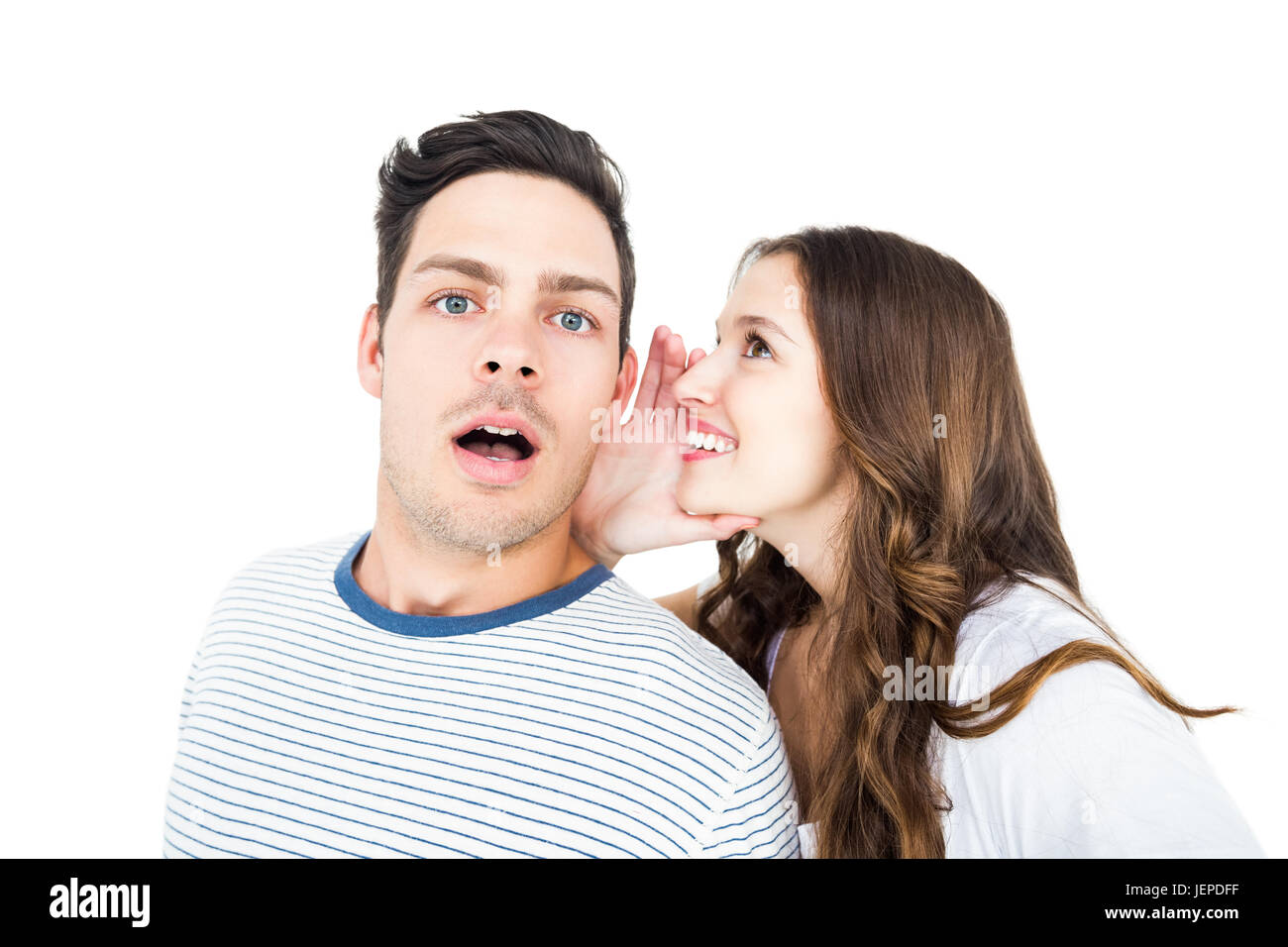 Young couple sharing a secret Stock Photo - Alamy
