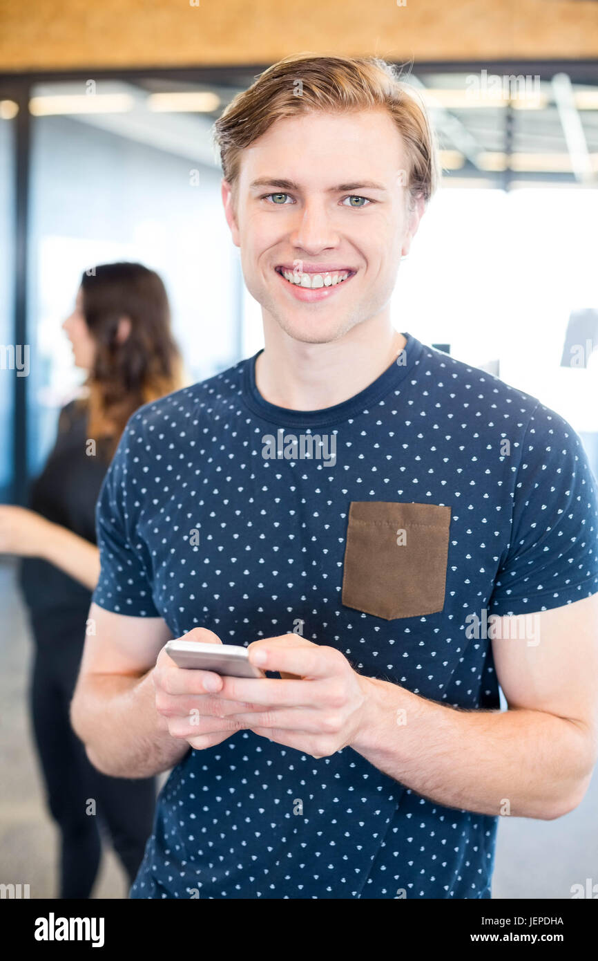 Man text messaging on smartphone Stock Photo - Alamy