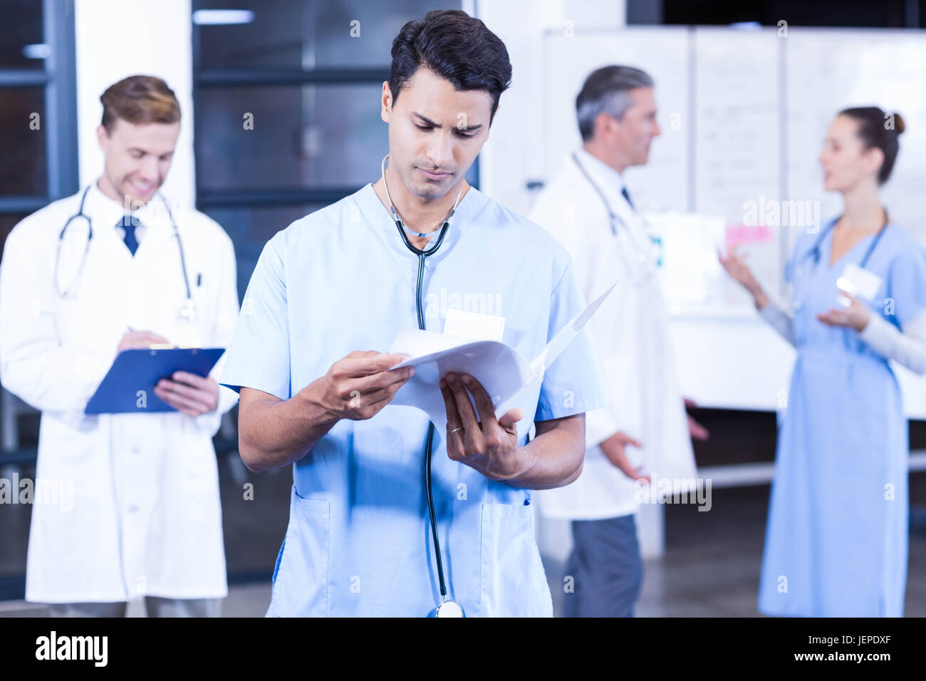 Nurse checking report hi-res stock photography and images - Alamy