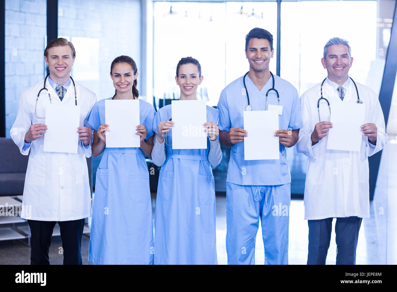 Portrait of doctors showing medical reports Stock Photo - Alamy