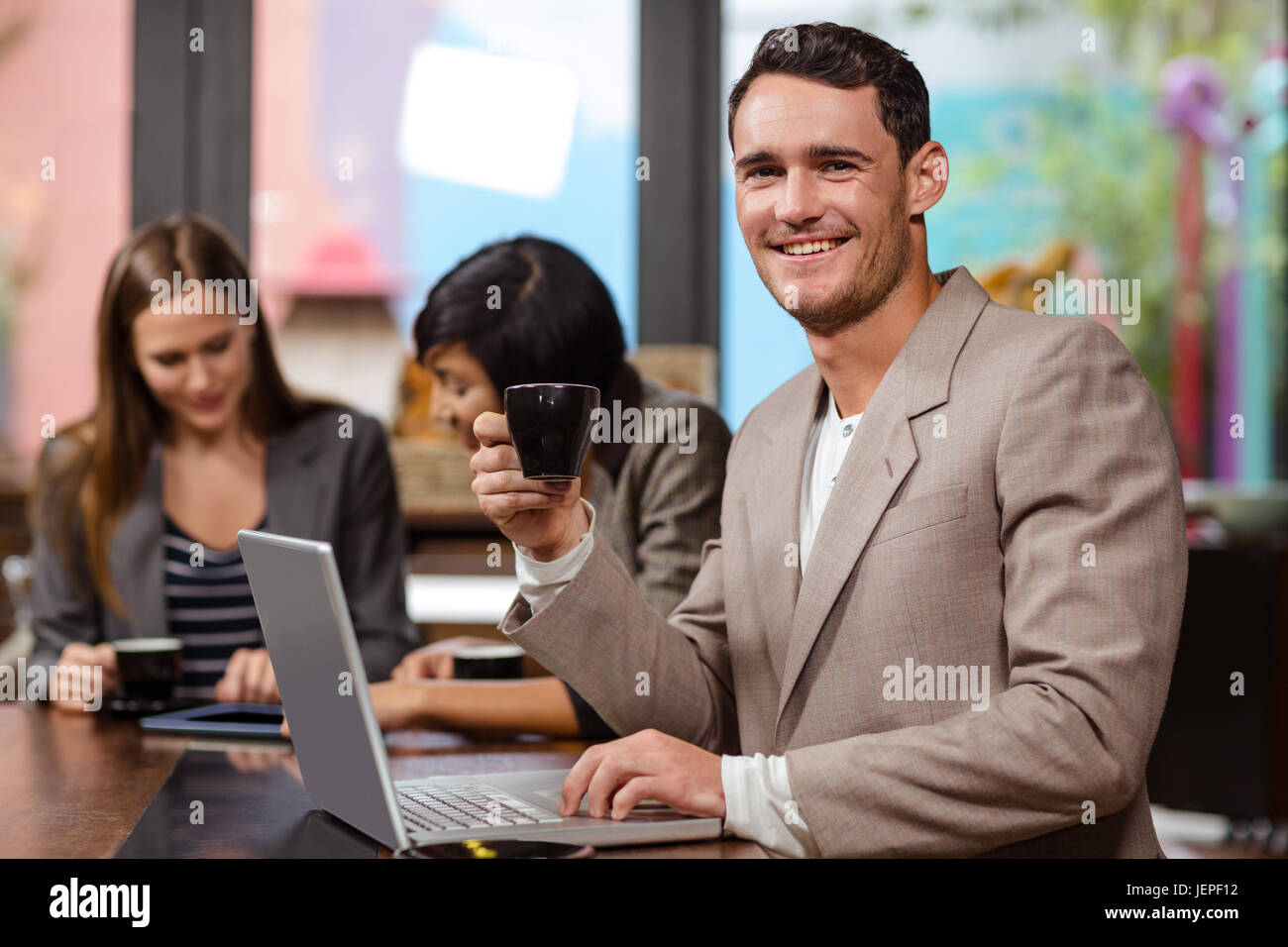 Friends using technology Stock Photo - Alamy
