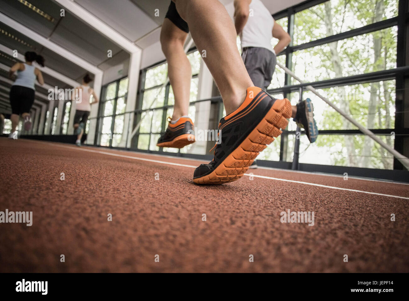 Four women running hi-res stock photography and images - Alamy