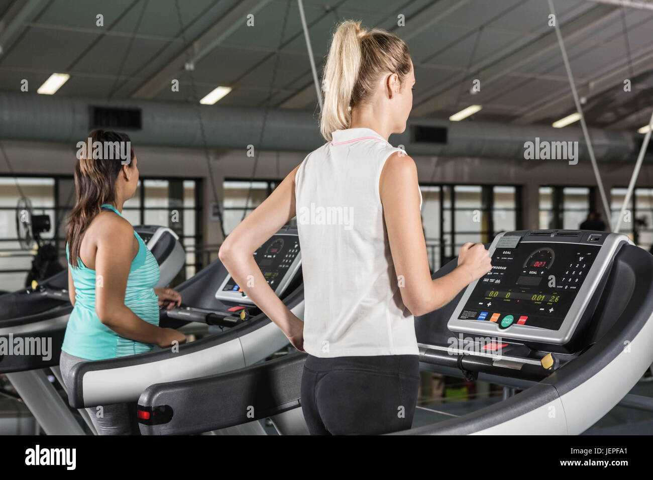 Women exercising on a treadmill Stock Photo - Alamy