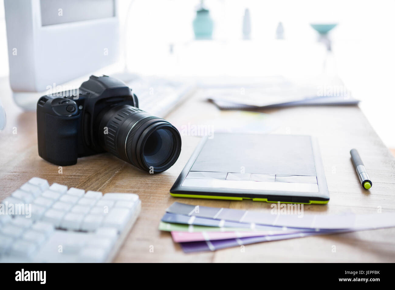 digital camera on an office desk Stock Photo - Alamy