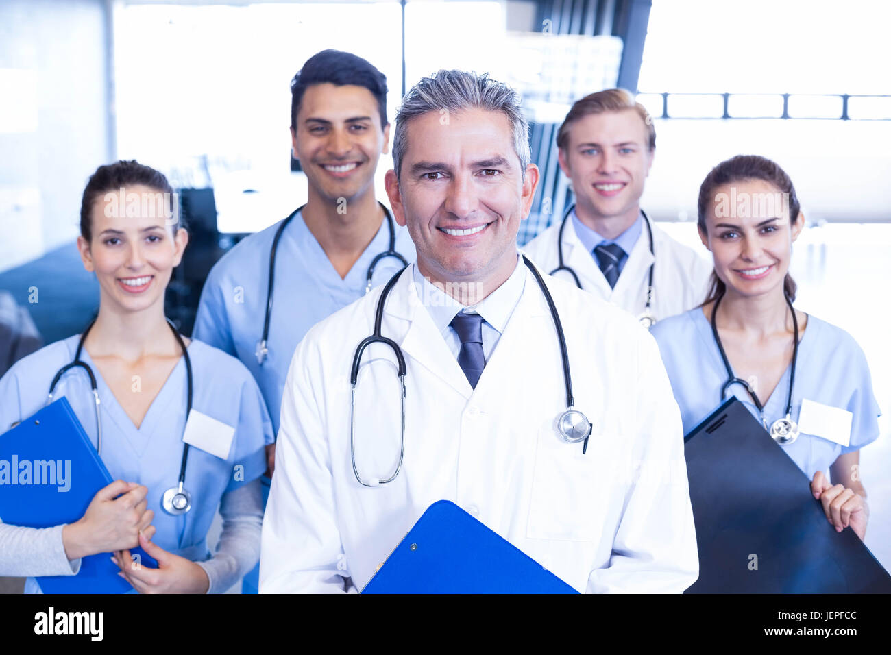 Portrait of medical team standing together Stock Photo - Alamy