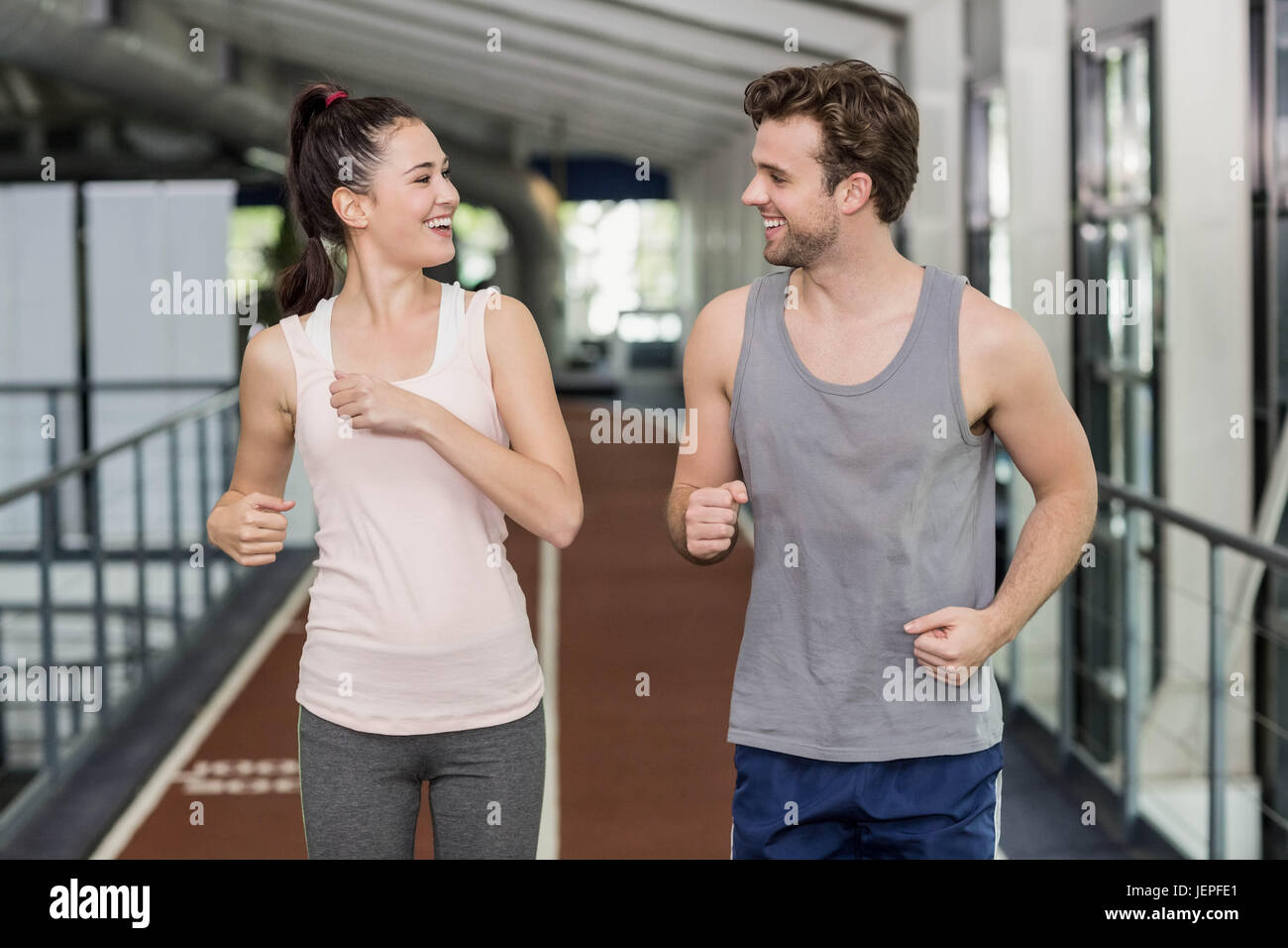 Happy friends running together Stock Photo - Alamy
