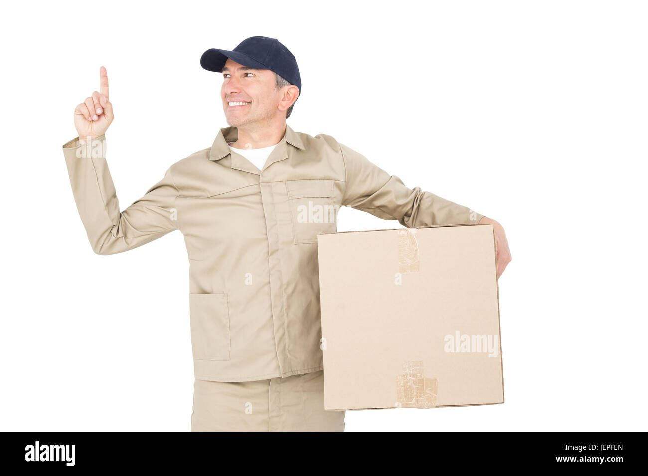 Delivery man carrying a package and pointing Stock Photo - Alamy