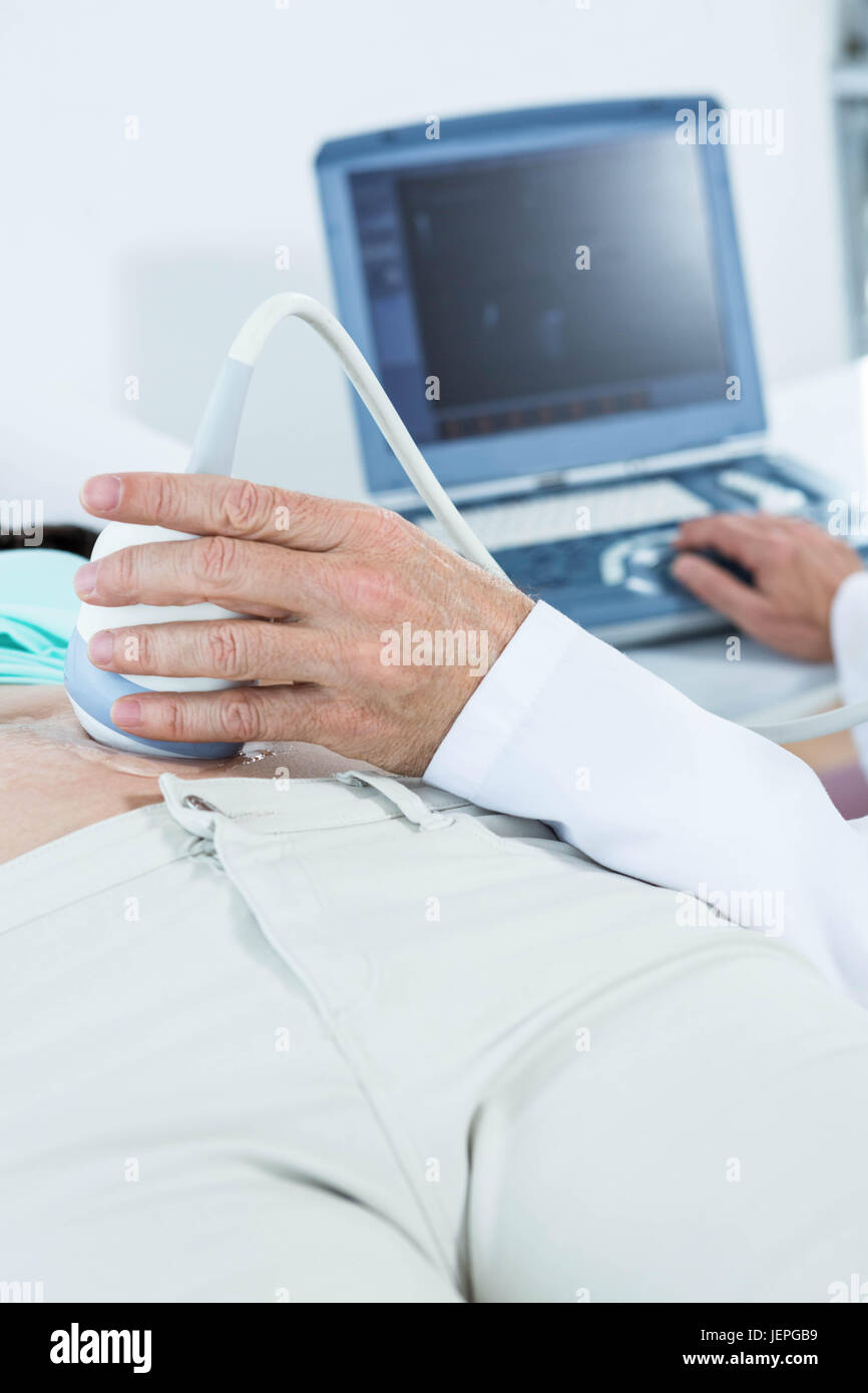 Pregnant woman undergoing ultrasound test Stock Photo - Alamy